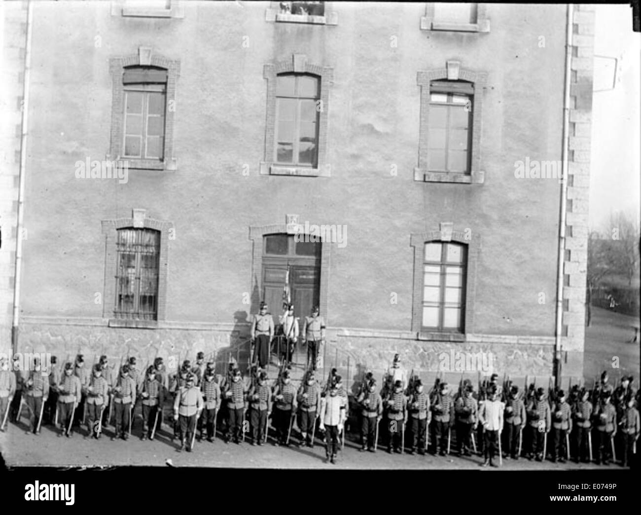 This historical image shows a group of soldiers posing in front of a ...