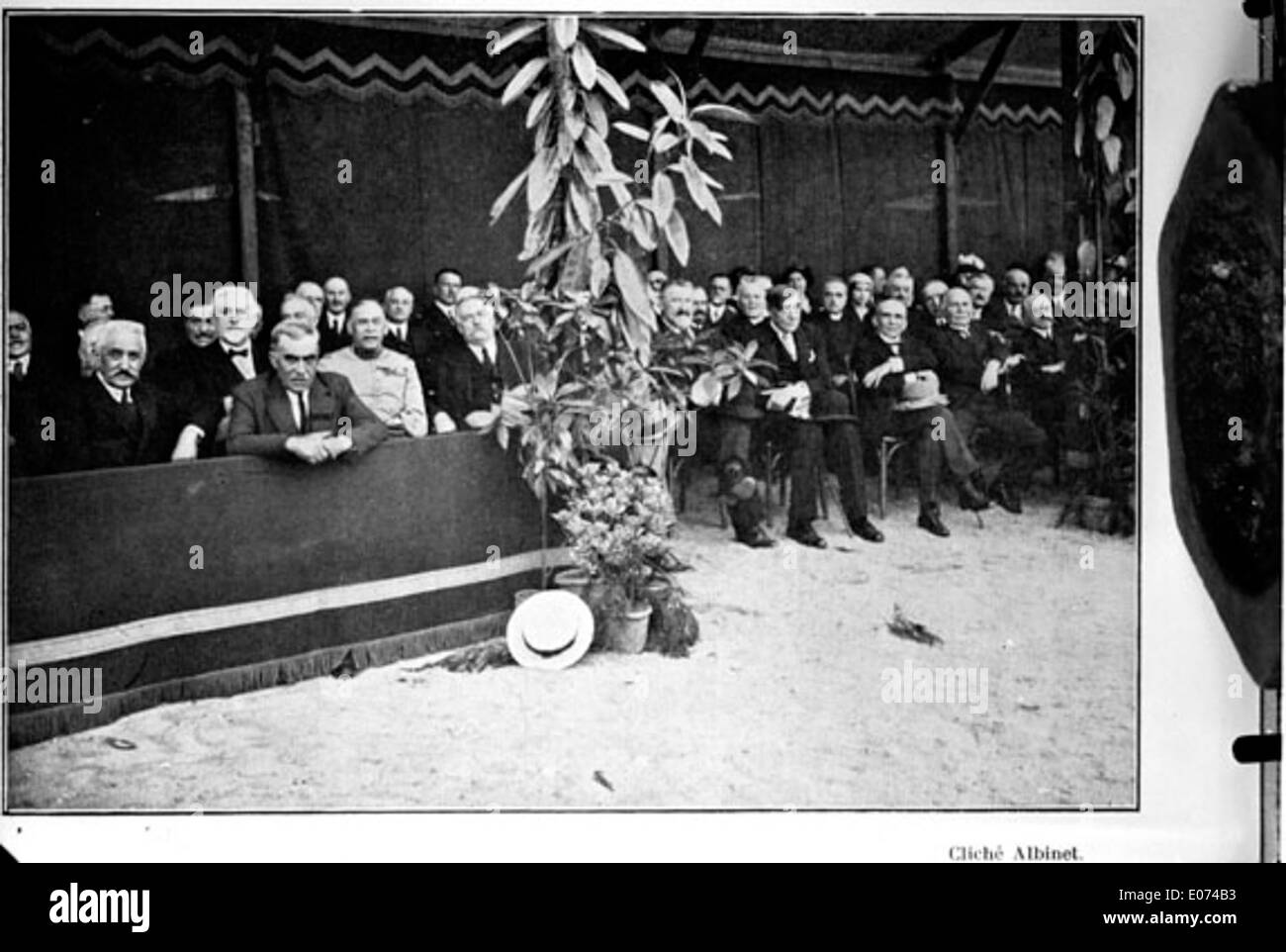 This historical photograph captures a group of men gathered in a ...