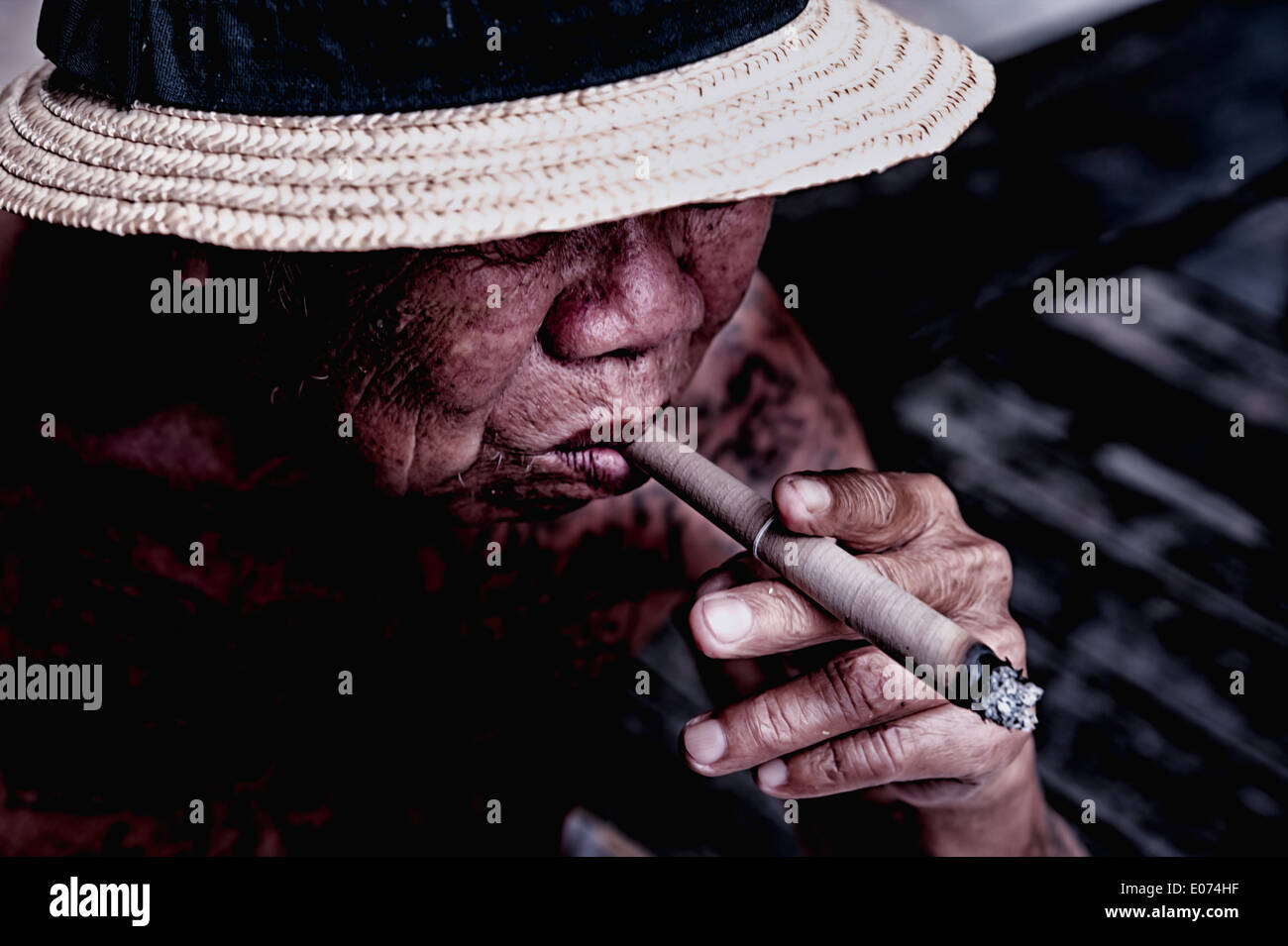 very old Man smoke a cigarette Stock Photo - Alamy