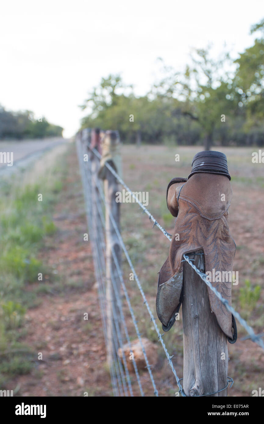 Cowboy Boots On Fence High Resolution Stock Photography and Images - Alamy