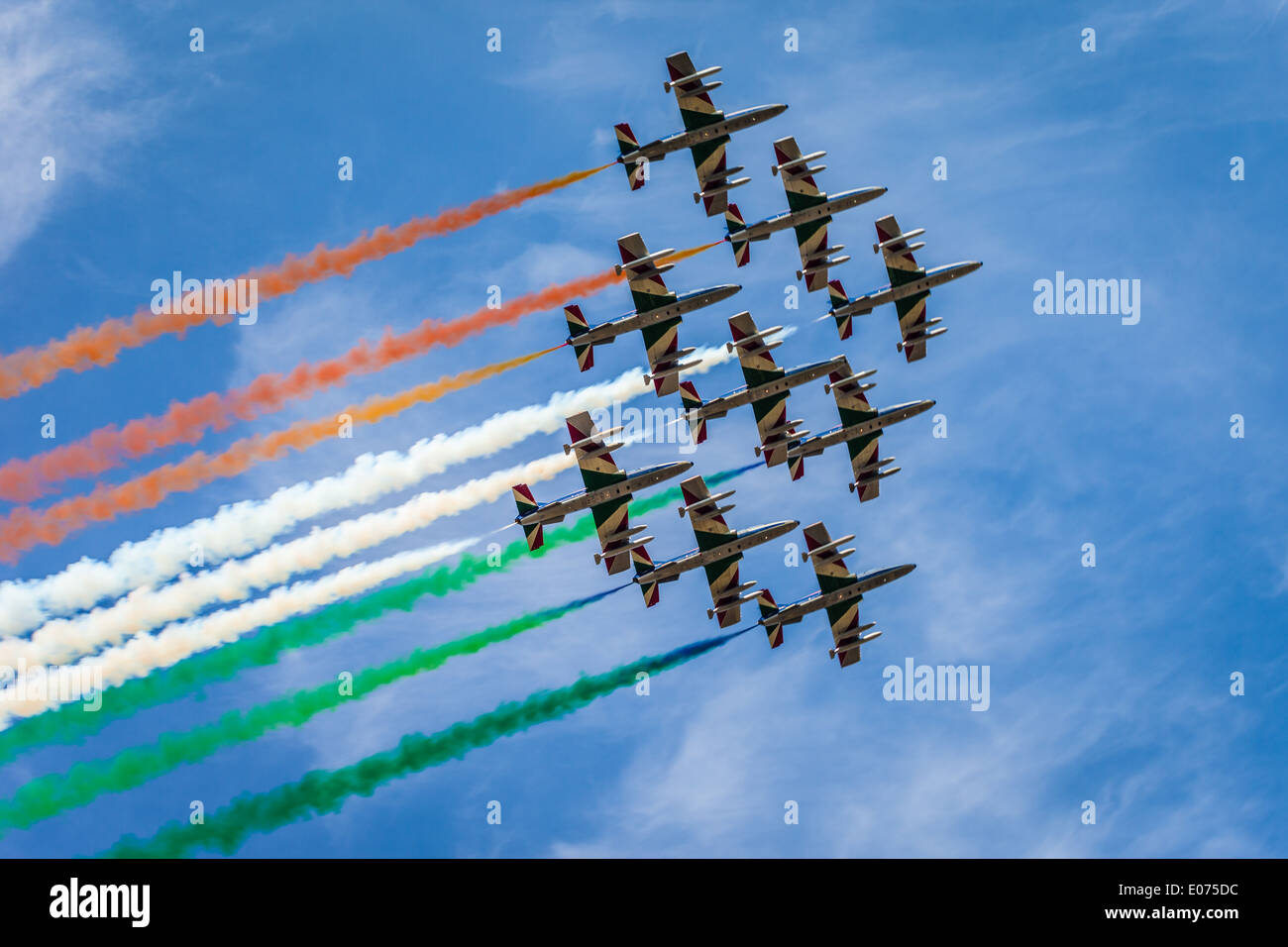 The italian acrobatic jet squad named "frecce tricolori" doing tricks ...
