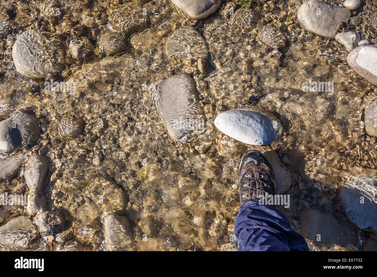 Rock in muddy water hi-res stock photography and images - Alamy
