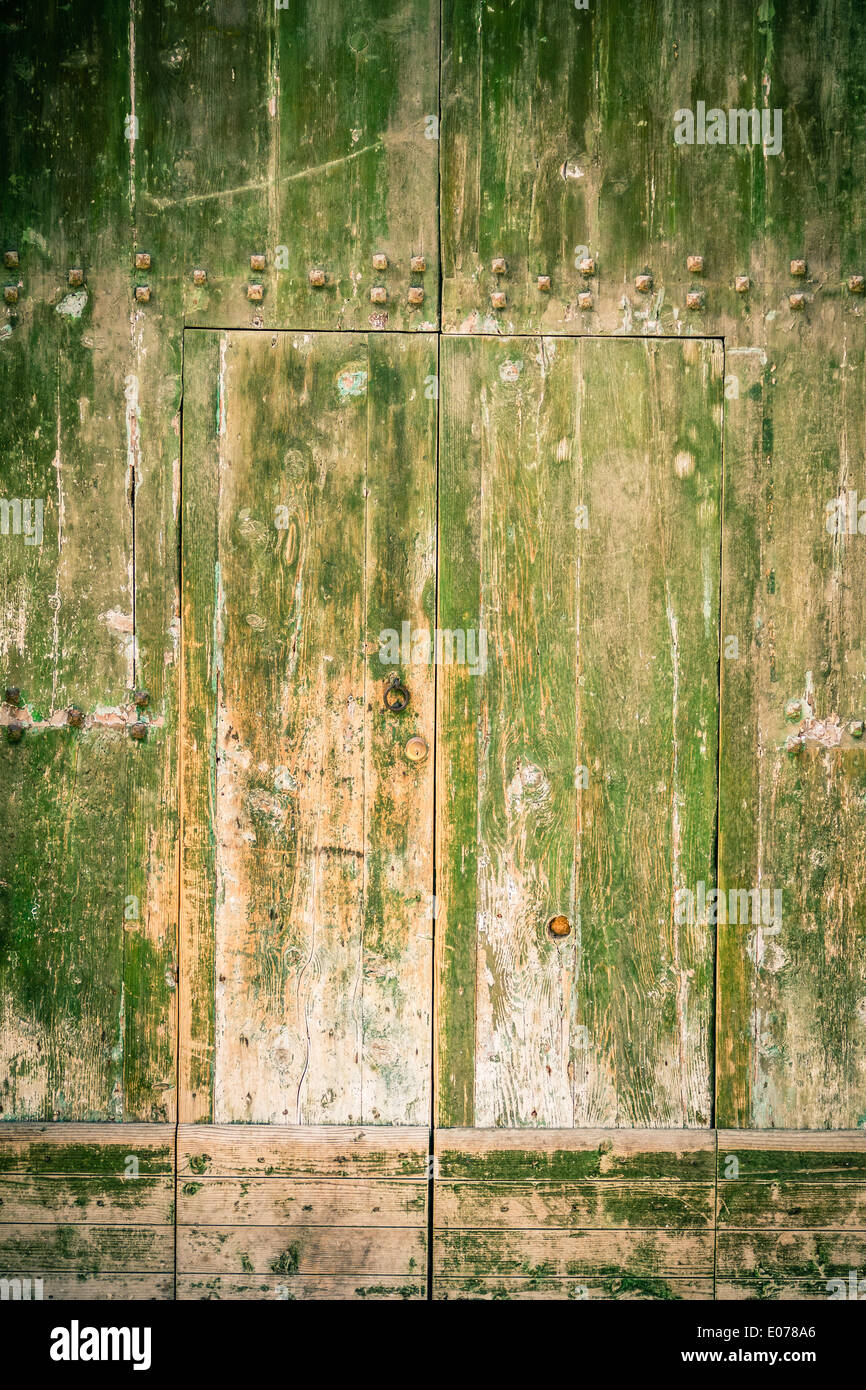 an old, rusty wooden door with lot of scratches and peeling paint Stock ...