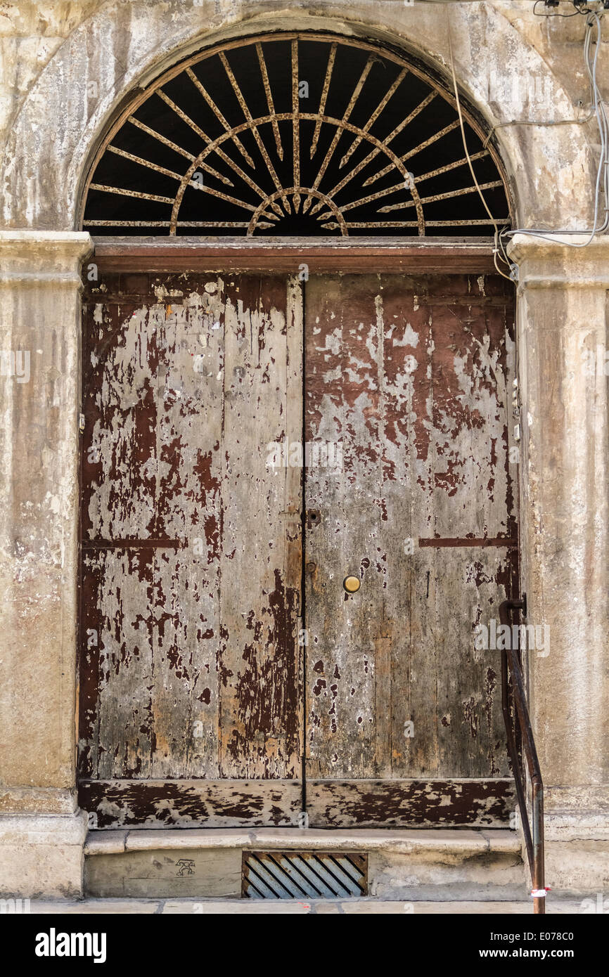 an old, rusty wooden door with lot of scratches and peeling paint Stock ...
