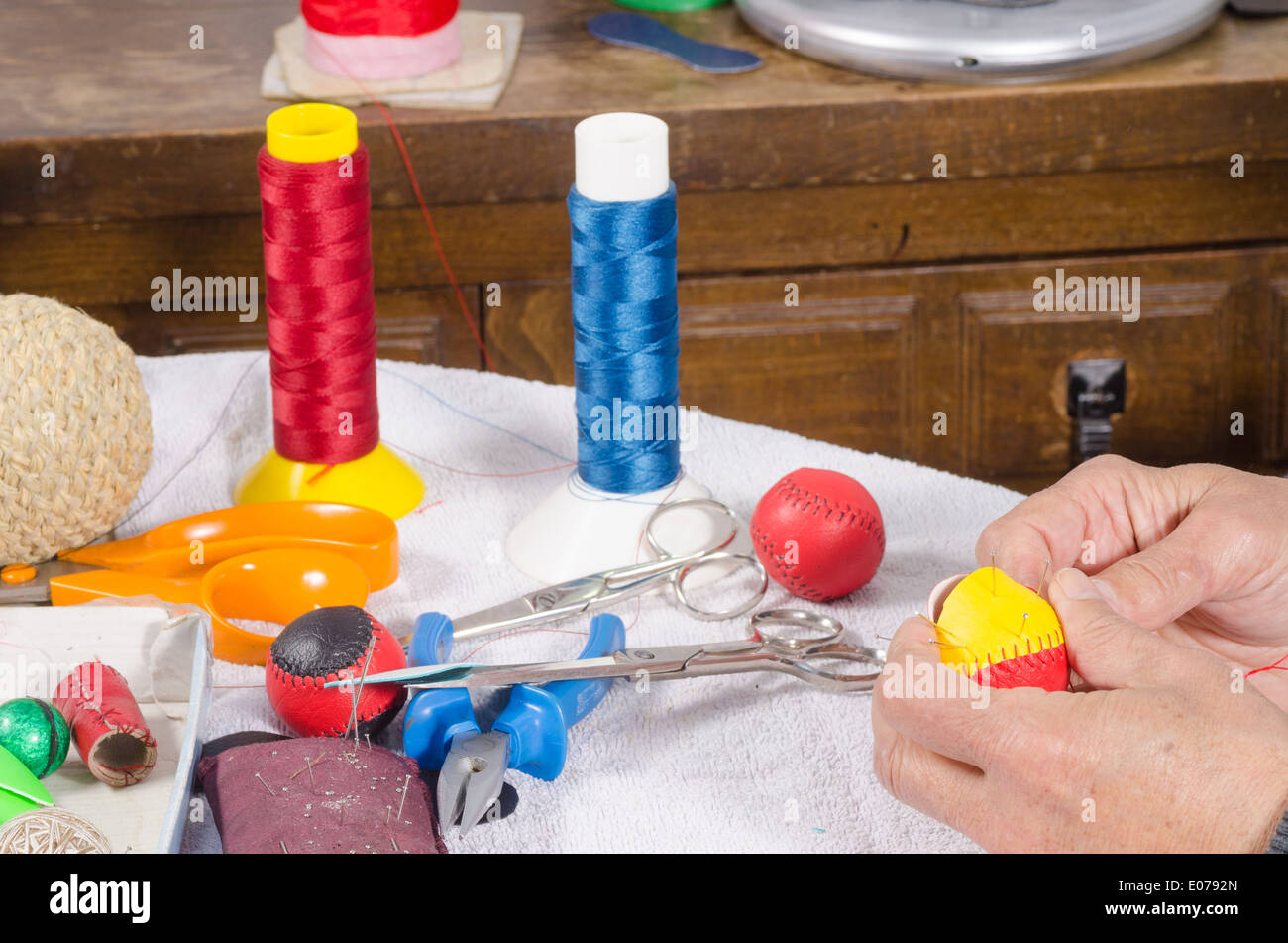 Expert hands crafting traditional sport balls Stock Photo - Alamy