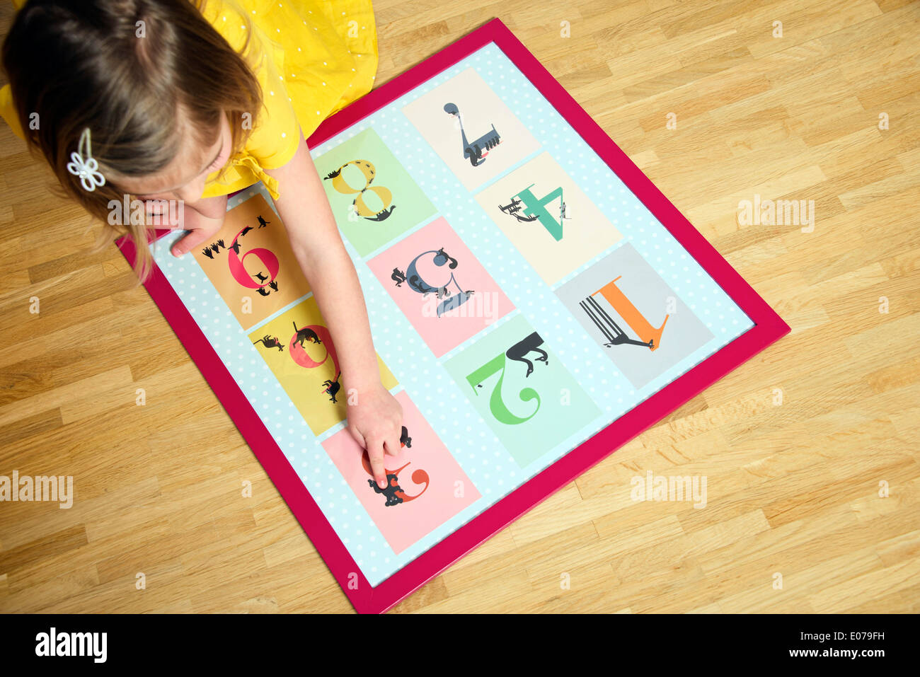 Girl learning numbers in nursery Stock Photo - Alamy