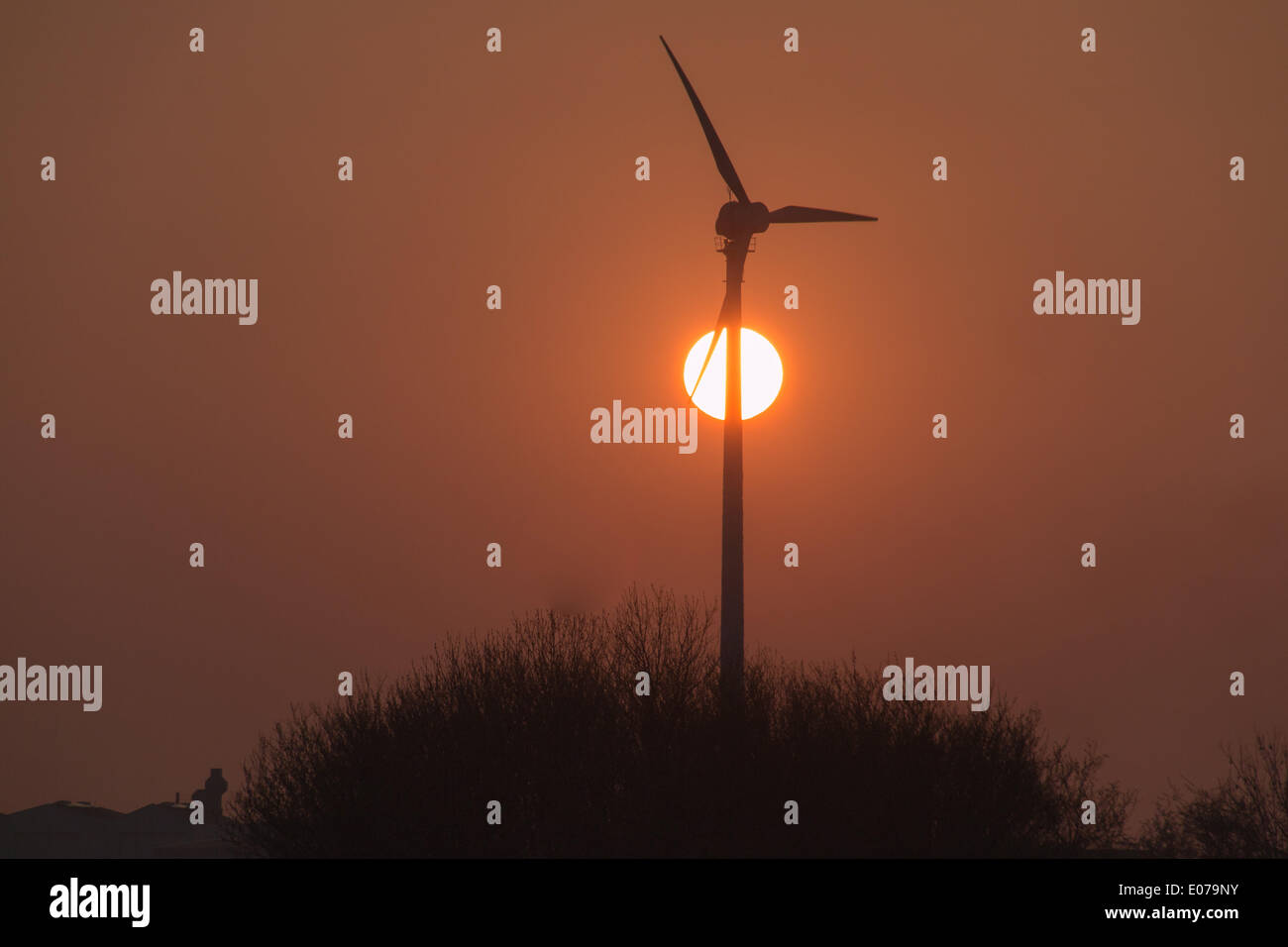 high voltage mast with sun Stock Photo - Alamy