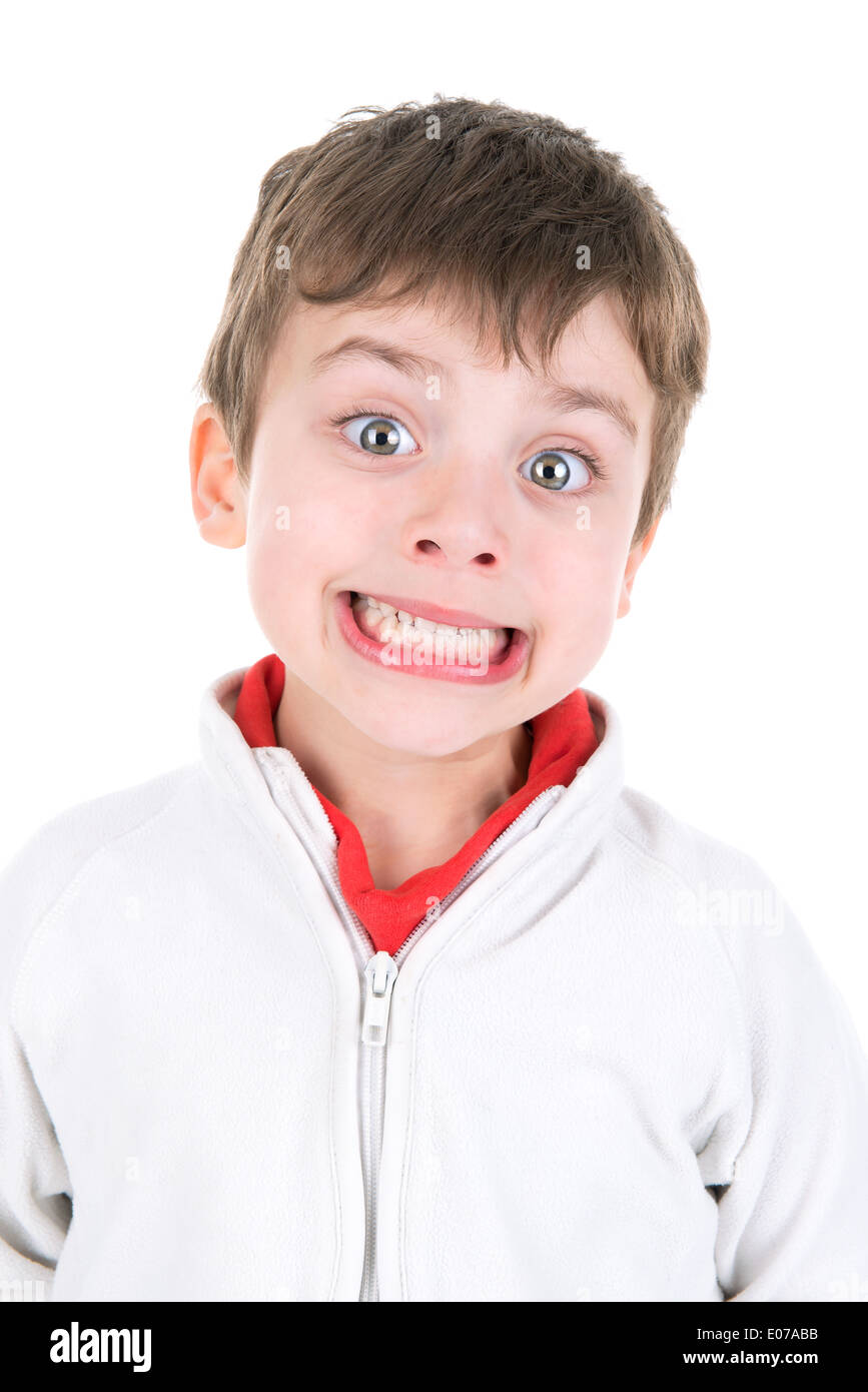 Young boy making faces isolated in white Stock Photo - Alamy