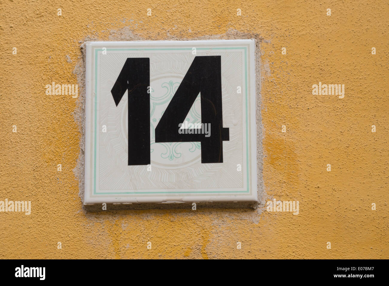 Door number on a wall Stock Photo - Alamy
