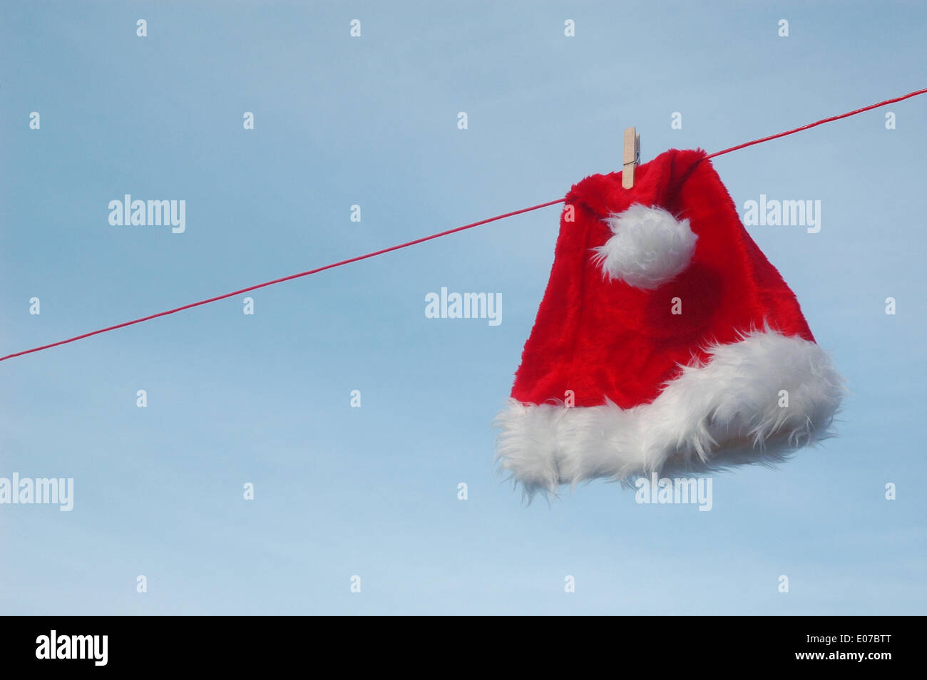 Illustration - A Santa Claus hat is pictured on a clothesline, 28 ...