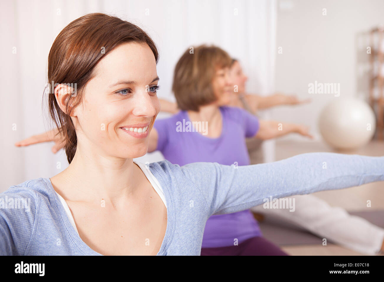 Three women doing Pilates exercises Stock Photo - Alamy