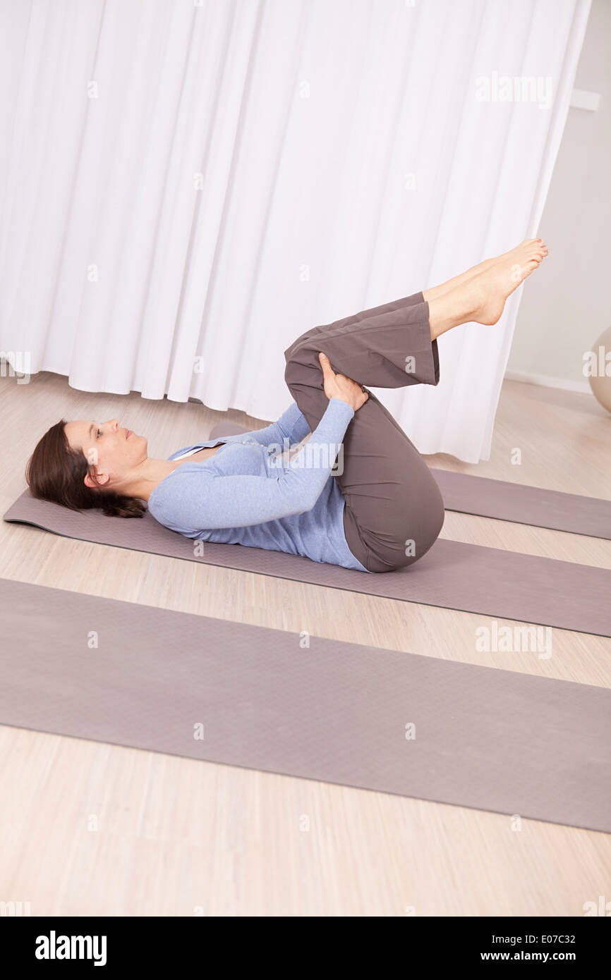 One woman lying on back feet up hi-res stock photography and images - Alamy