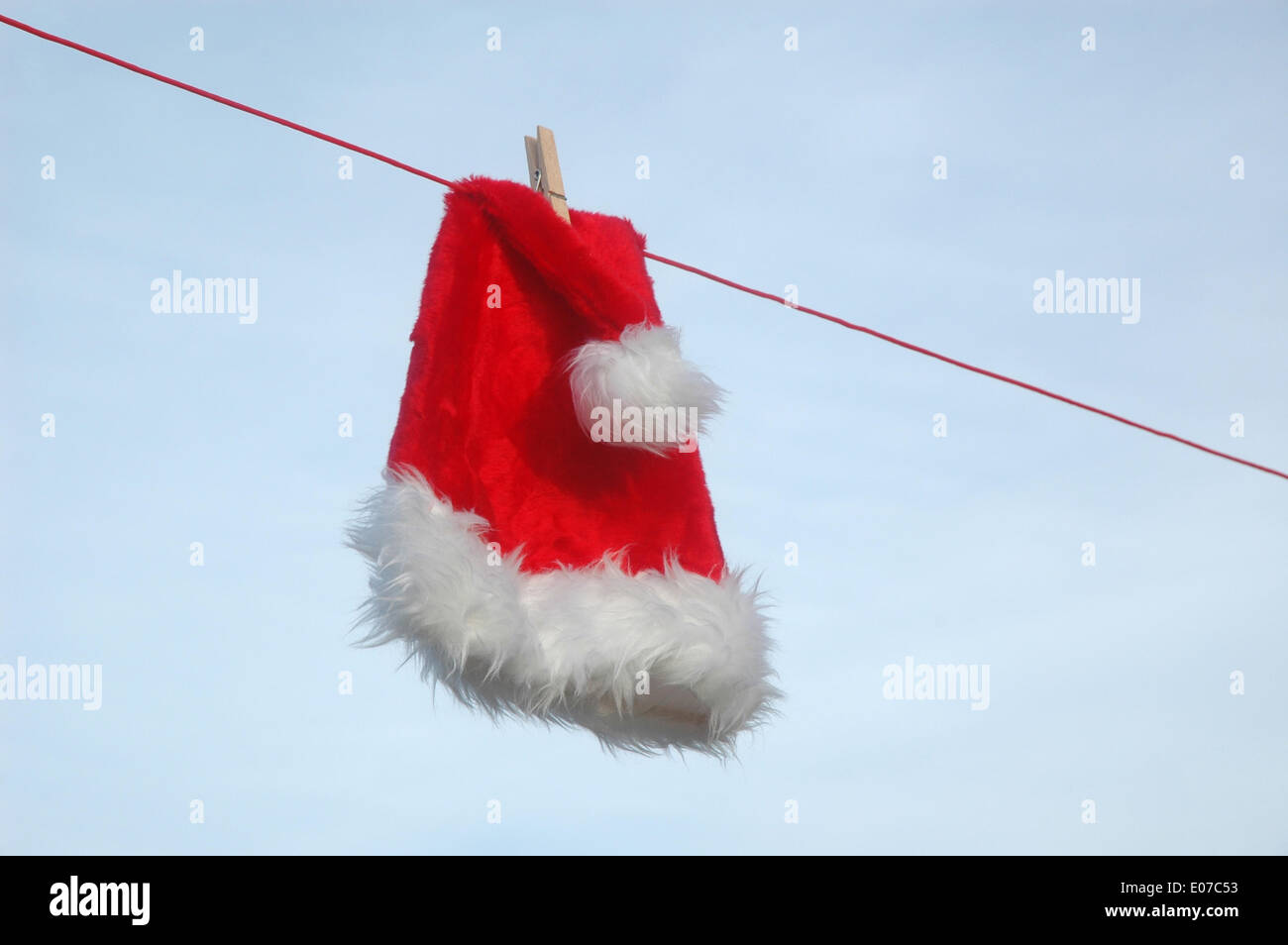 Illustration - A Santa Claus hat is pictured on a clothesline, 28 ...