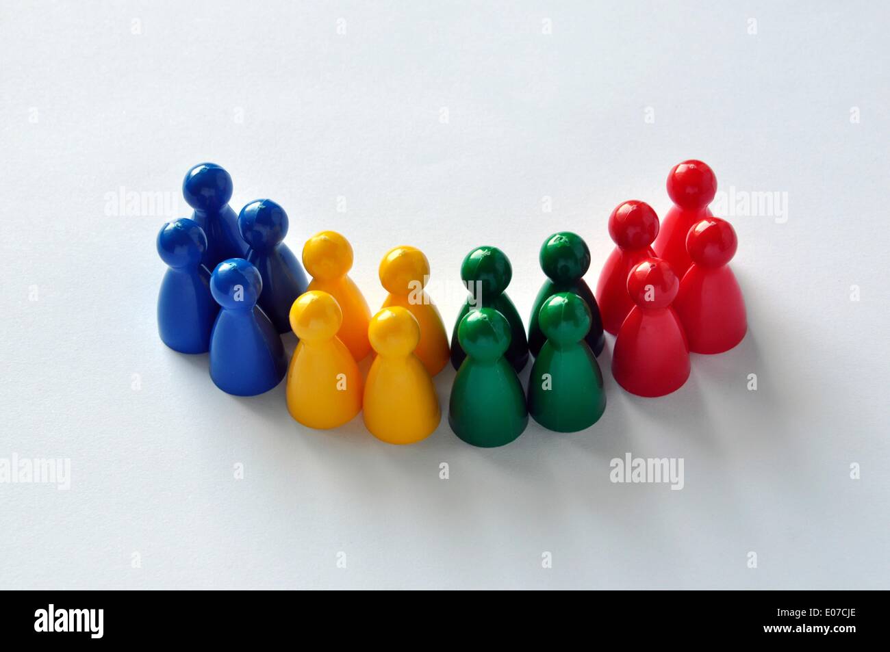 Illustration - Differently coloured groups of game pieces stand in a ...