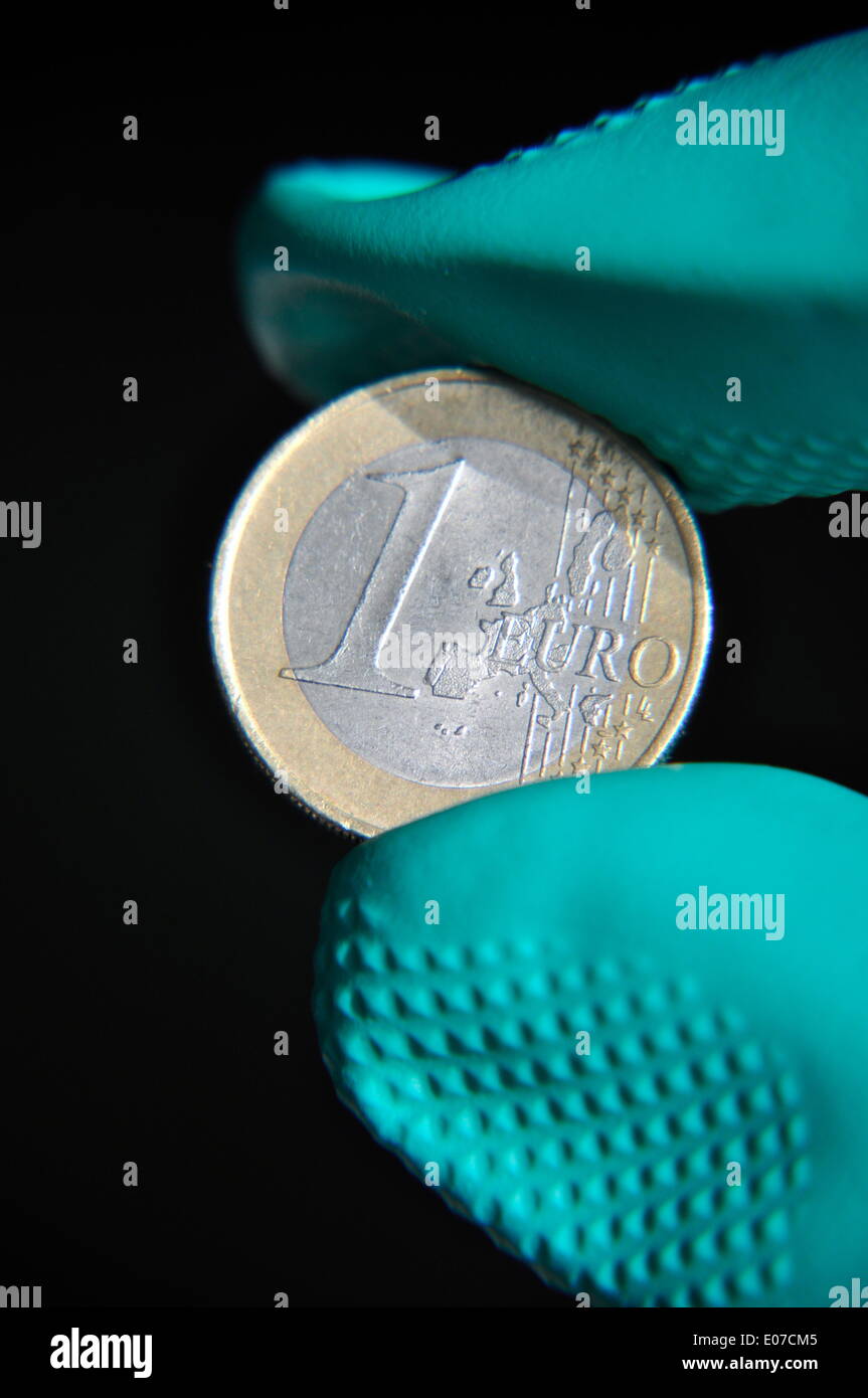 Illustration - a hand in a rubber glove holds a one euro coin in ...
