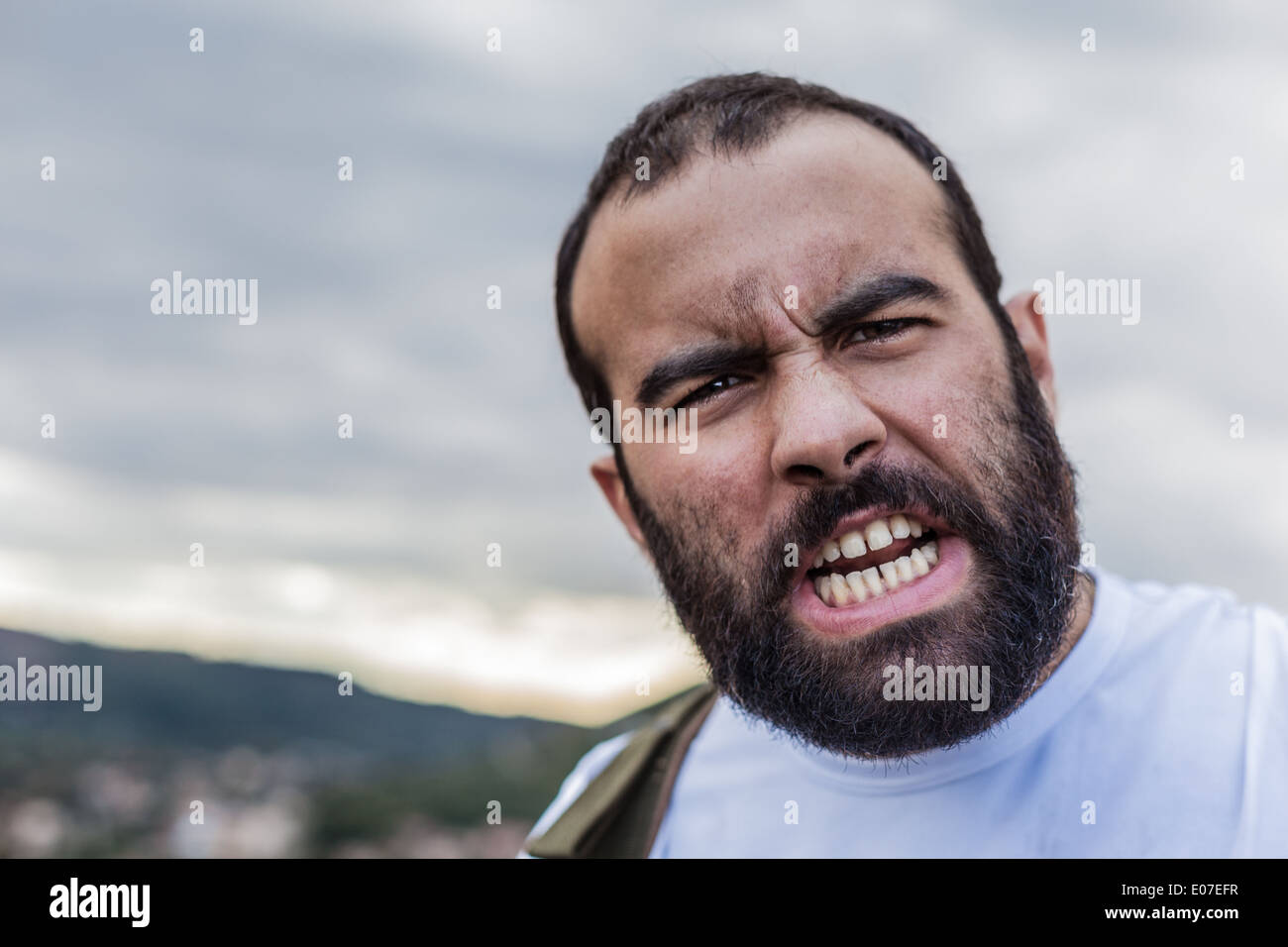 Angry man showing teeth hi-res stock photography and images - Alamy