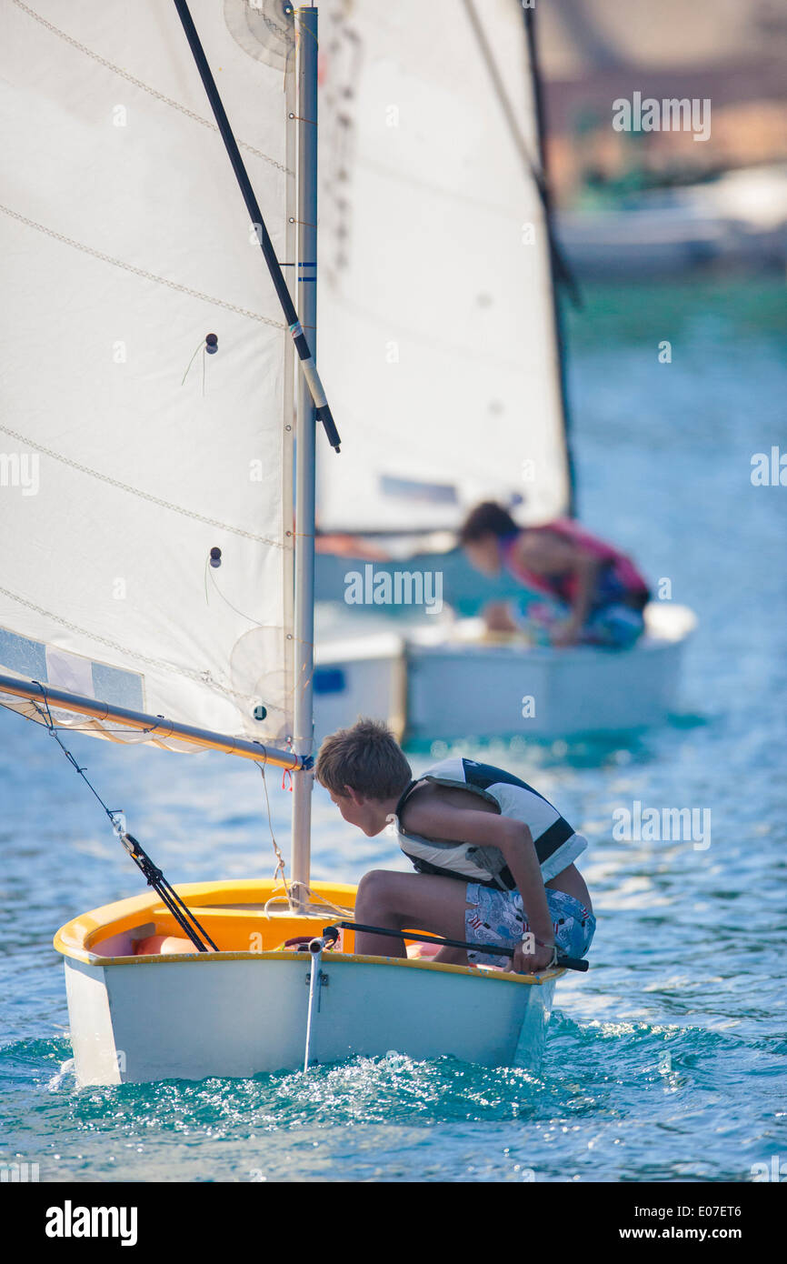 Two boys racing in a sailboat, Hvar island, Croatia Stock Photo - Alamy