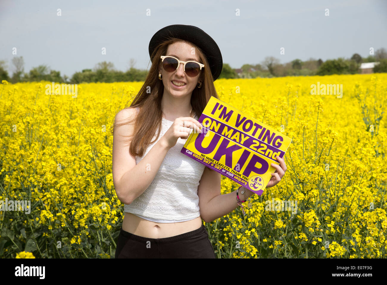 First time voter teenage girl in felt hat holding UKIP poster Stock ...