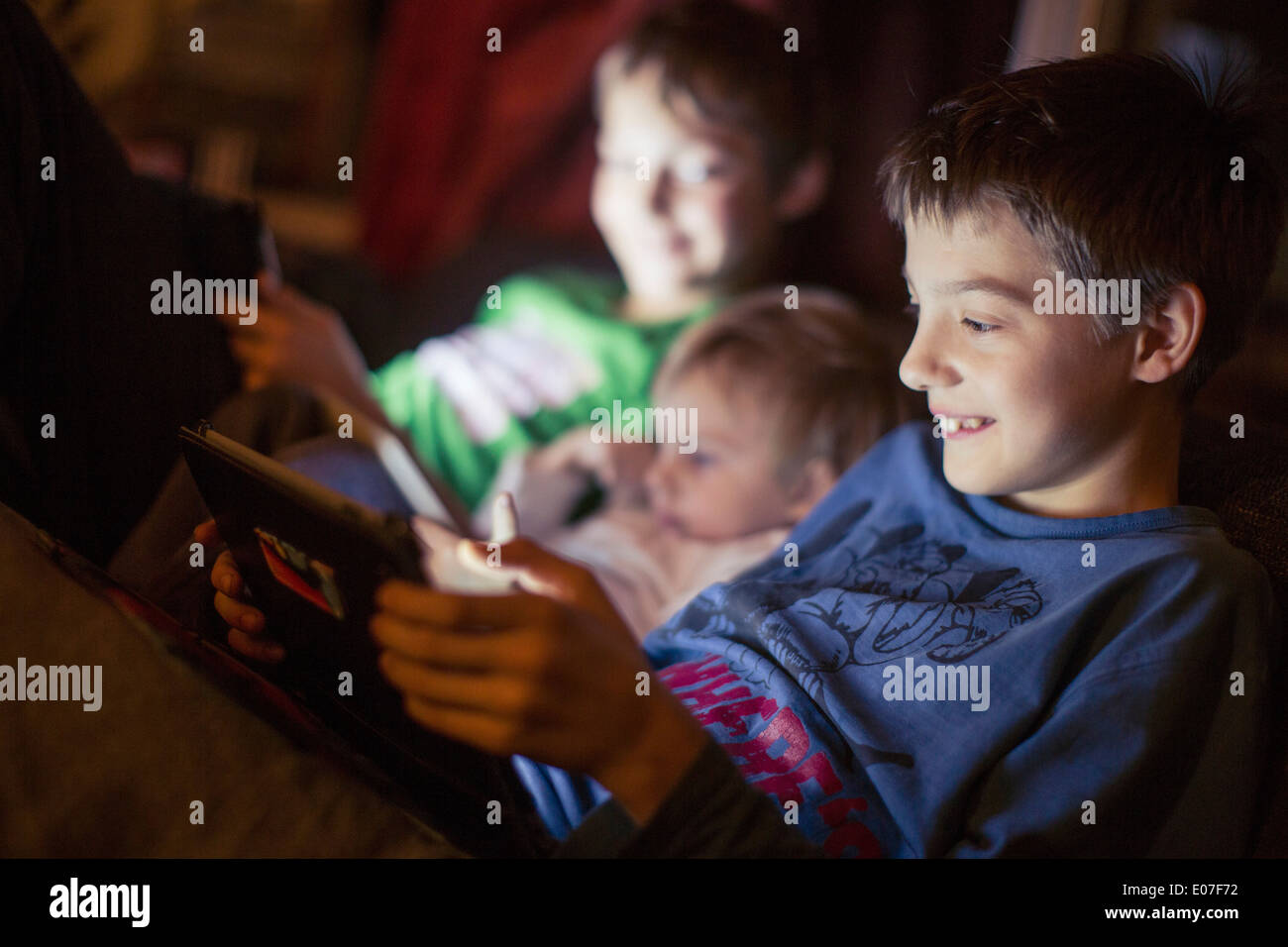 Two boys playing with digital tablets Stock Photo - Alamy