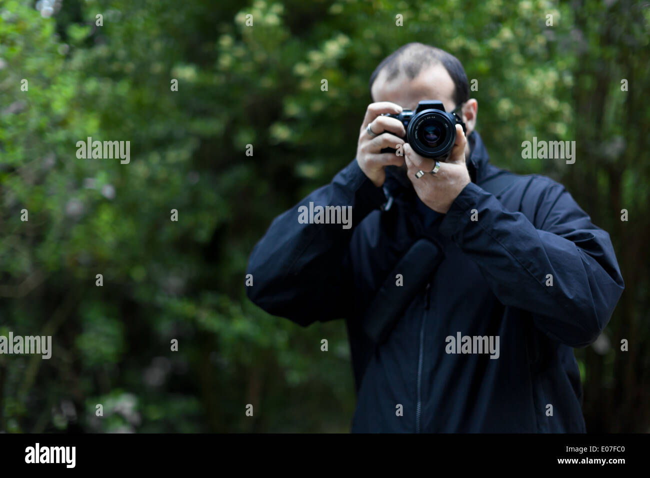 Front view of a shot with foliage background Stock Photo - Alamy