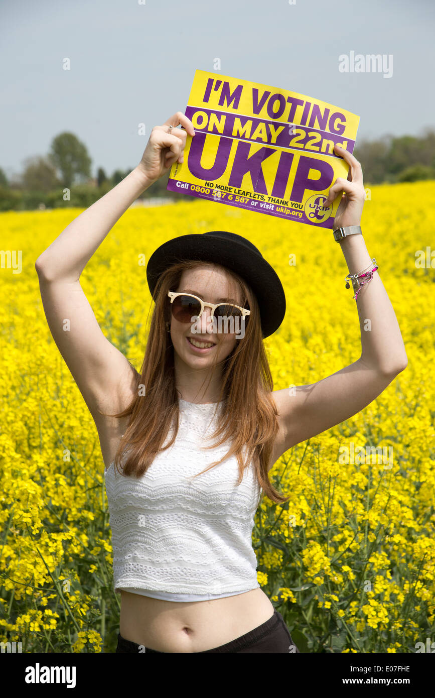 First time voter teenage girl in felt hat holding UKIP poster Stock ...