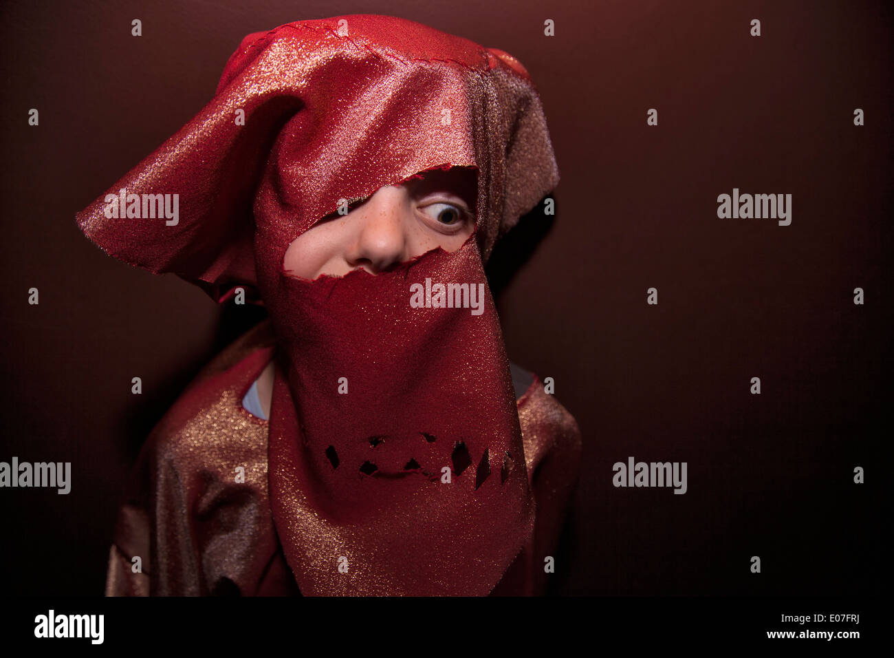 Little boy wearing hood over head Stock Photo - Alamy