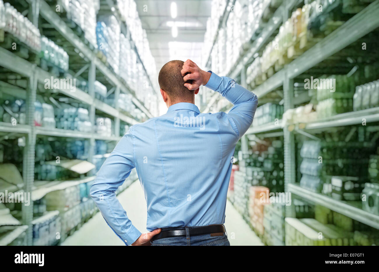 thinking man and shop warehouse background Stock Photo - Alamy