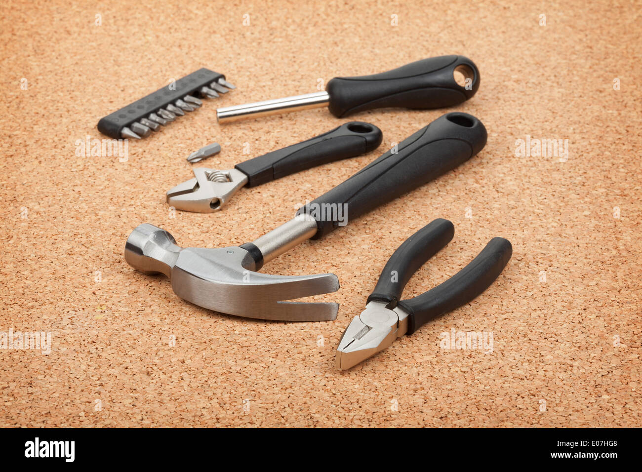 Set of tools on cork panel background Stock Photo - Alamy