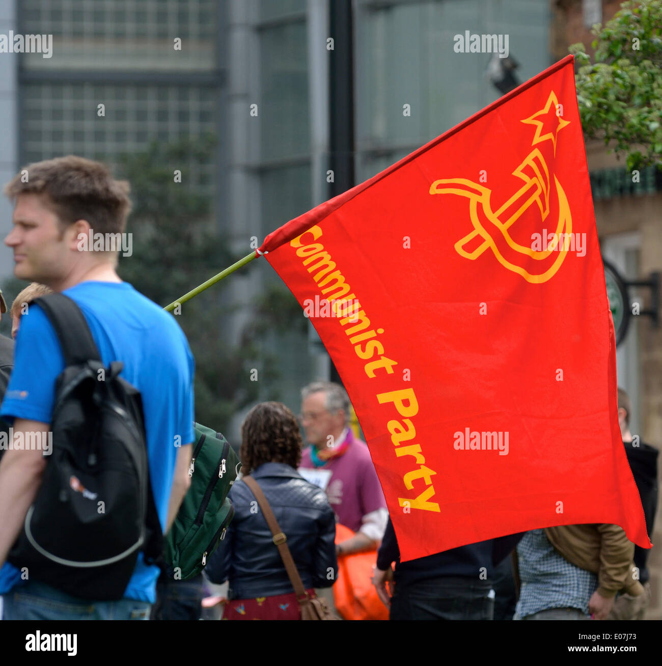 Manchester, UK. 5th May 2014. A protester hold a communist flag during ...