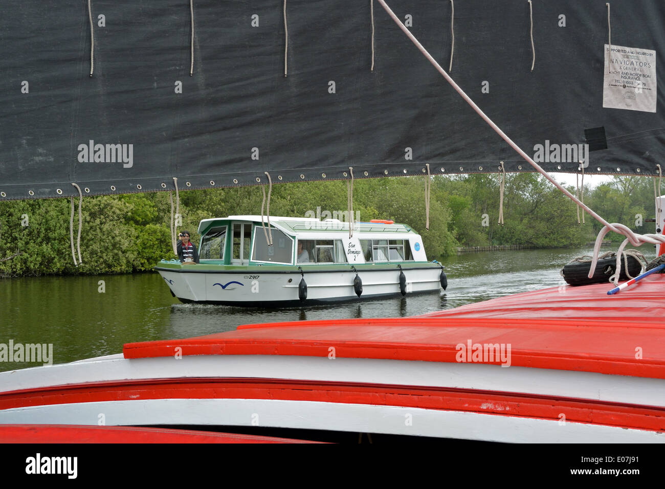Broads cruiser passing the historic trading wherry Albion on the River ...