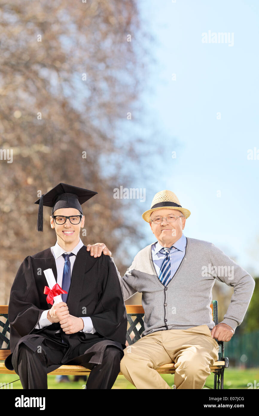 College graduate posing with his father outdoors Stock Photo - Alamy