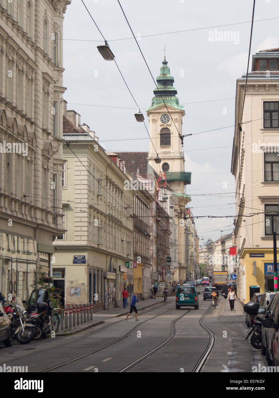 Street, buildings, traffic, tram tracks and a church steeple in the ...