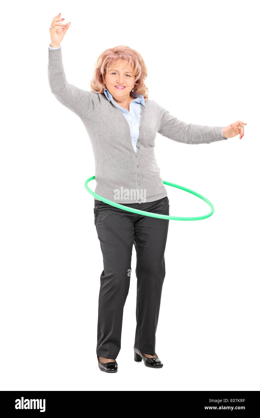 Mature woman spinning a hula hoop Stock Photo - Alamy