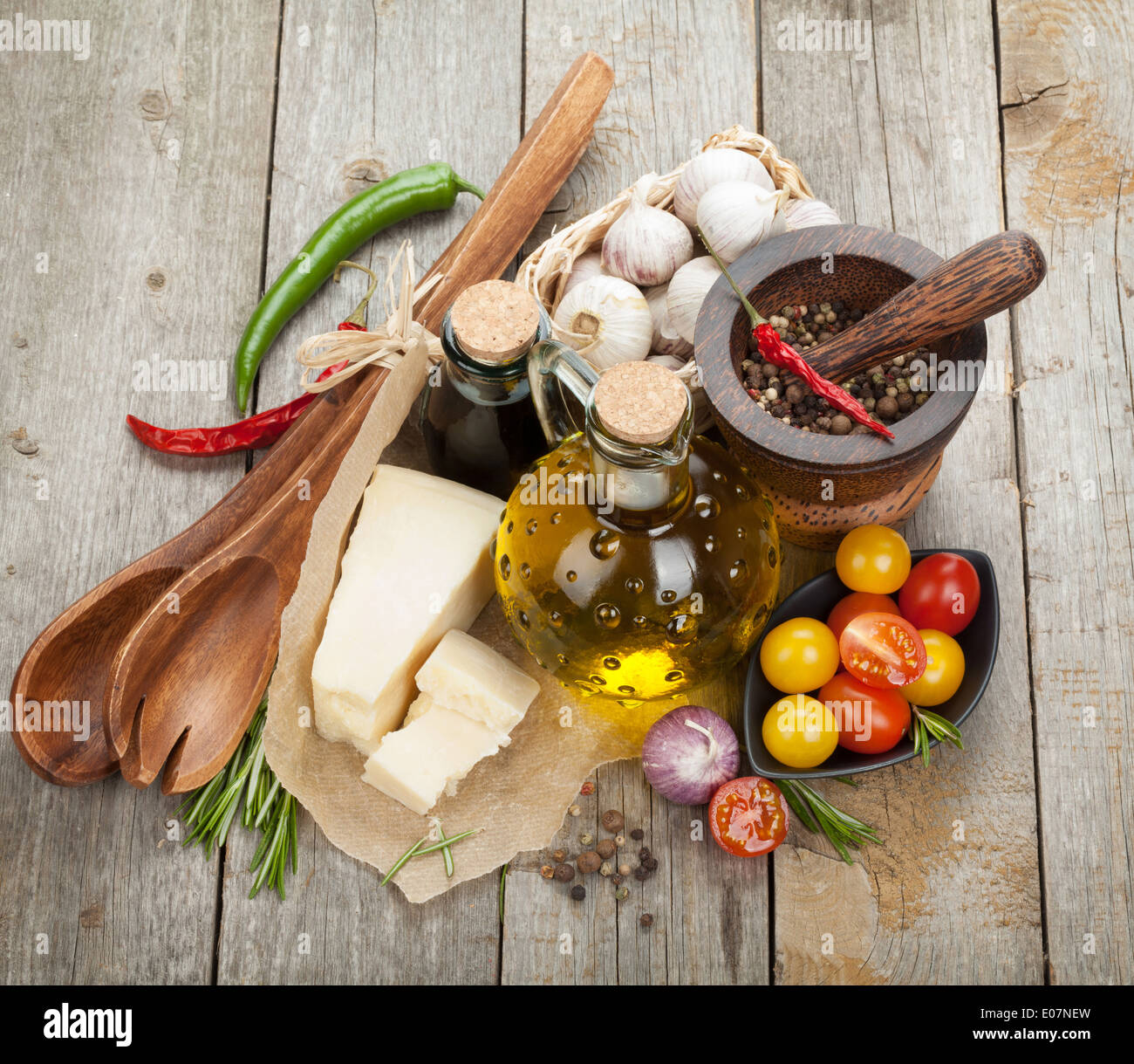Herbs, spices and seasoning over wooden table background Stock Photo ...