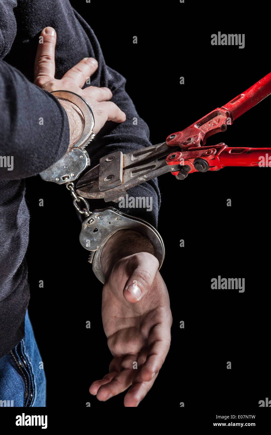 Thief arrested handcuffs hi-res stock photography and images - Alamy