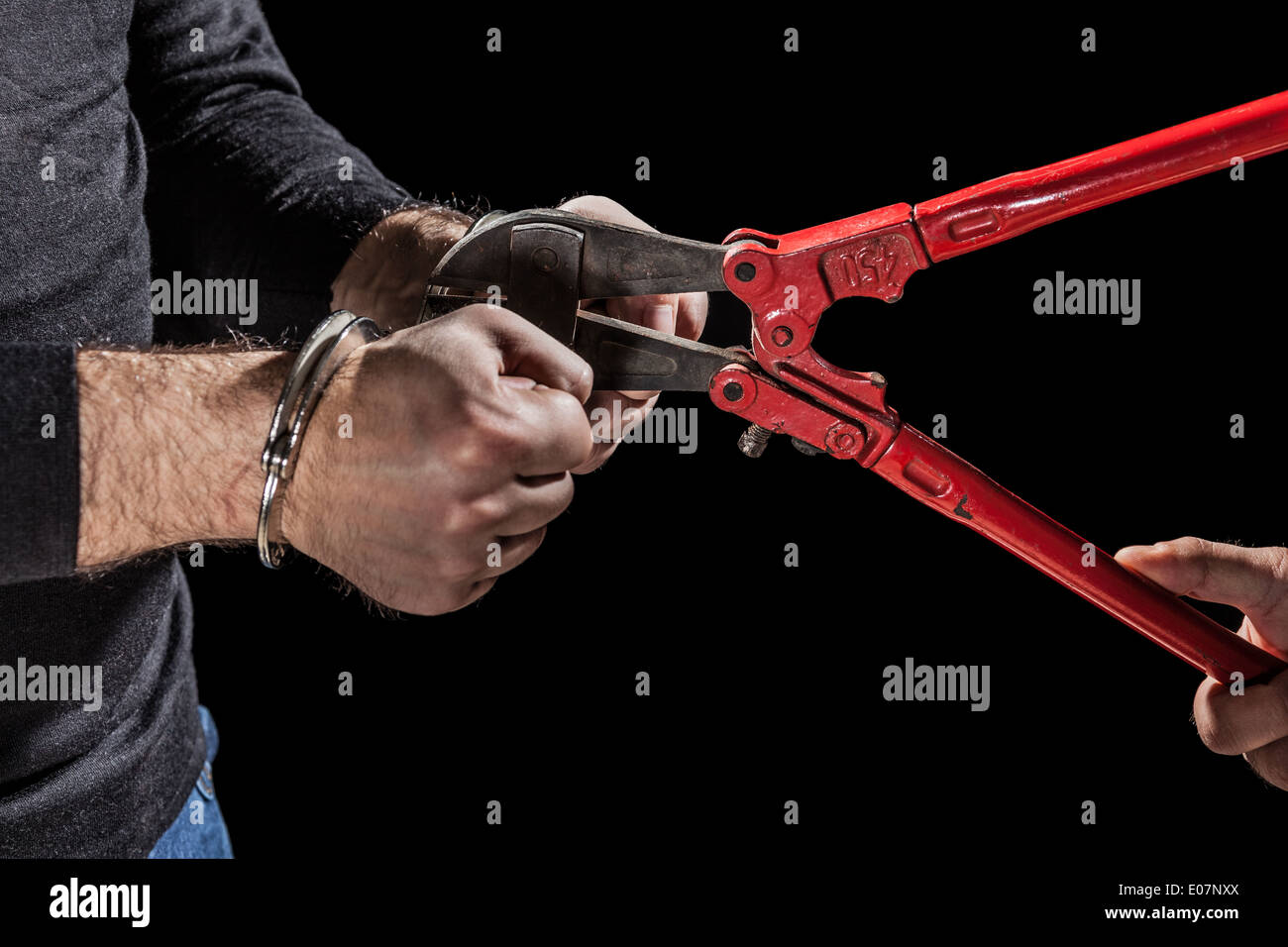 Thief arrested handcuffs hi-res stock photography and images - Alamy