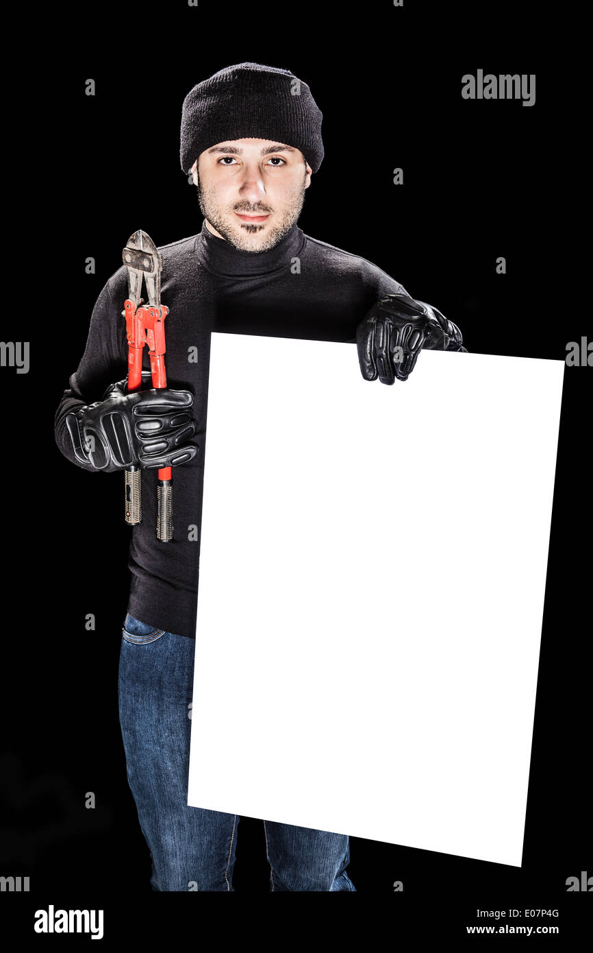 a burglar holding a white banner and a pair of big red clippers Stock ...