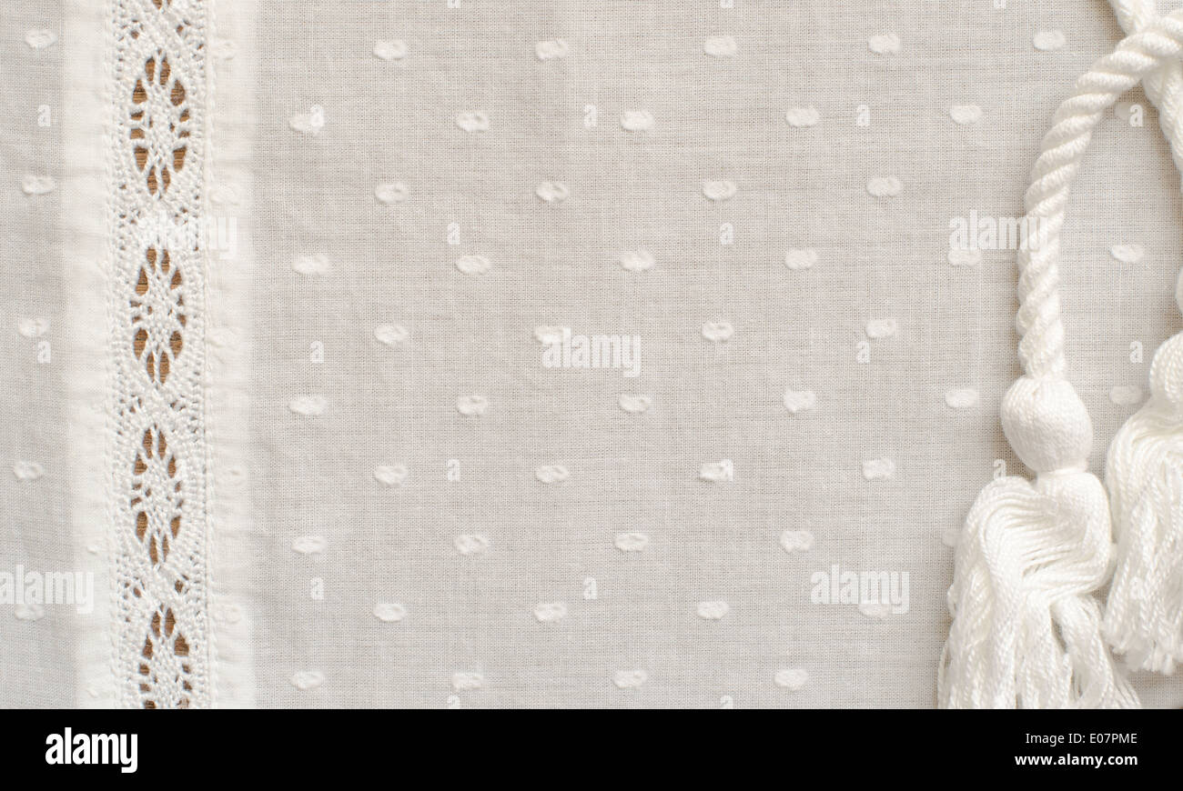 Spotted fabric with a strip of lace Stock Photo - Alamy