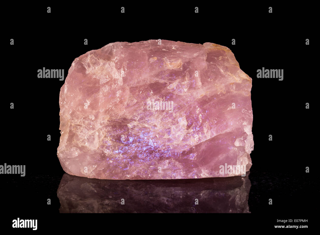 rose quartz birthstone in front of black Stock Photo - Alamy
