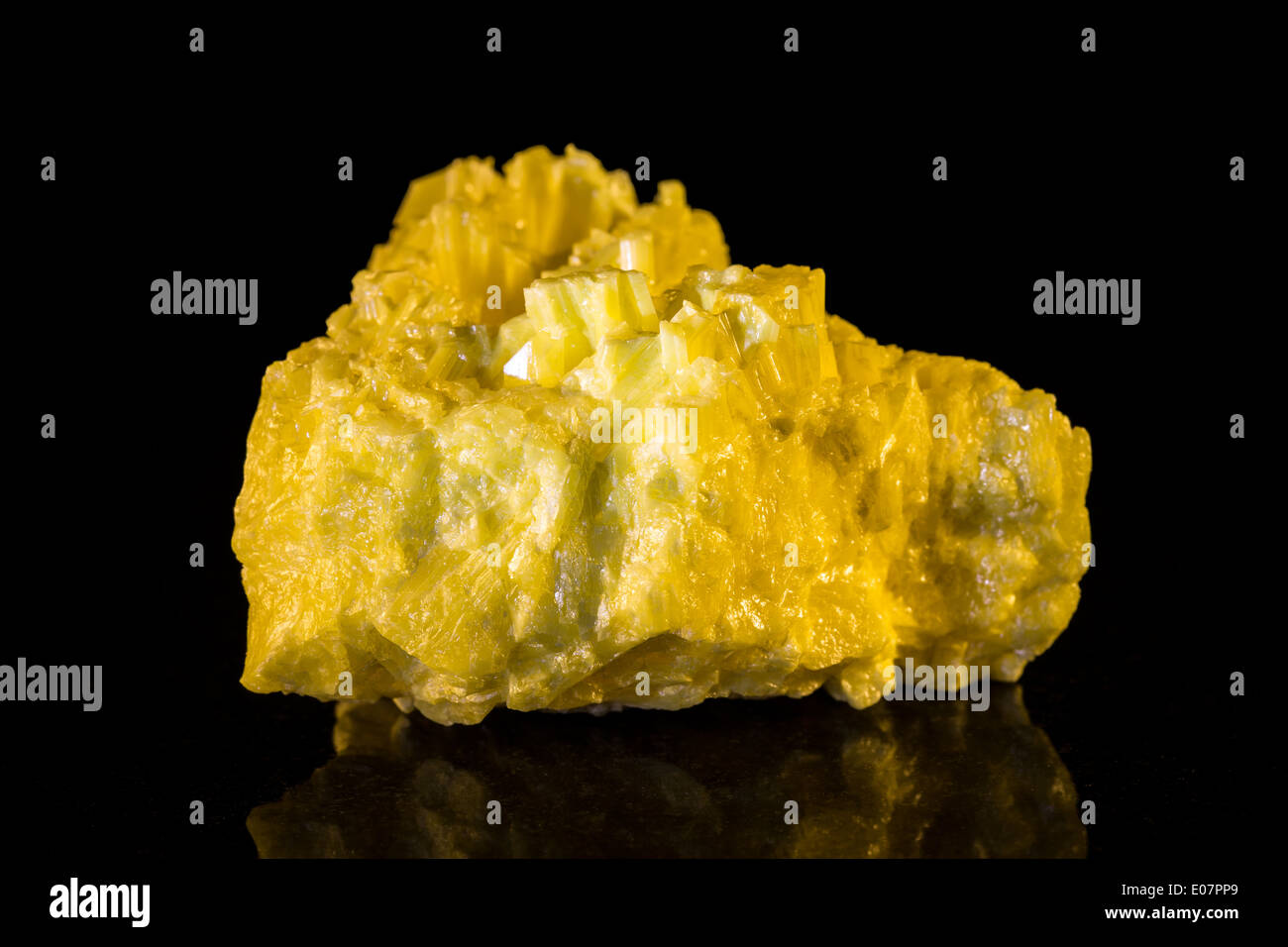 sulfur gemstone in front of black Stock Photo - Alamy