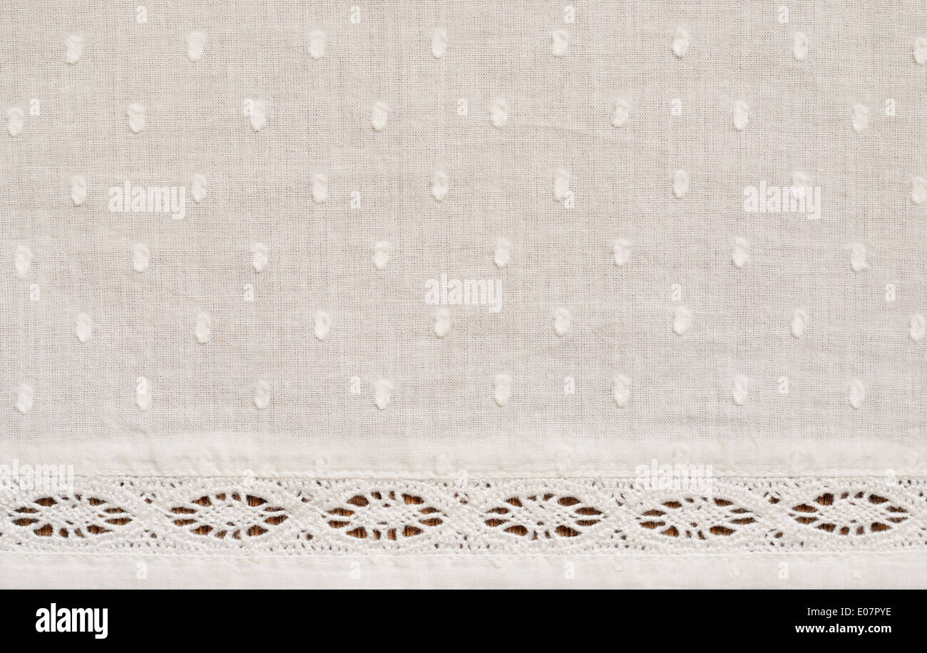 Background of spotted fabric with a strip of lace Stock Photo - Alamy