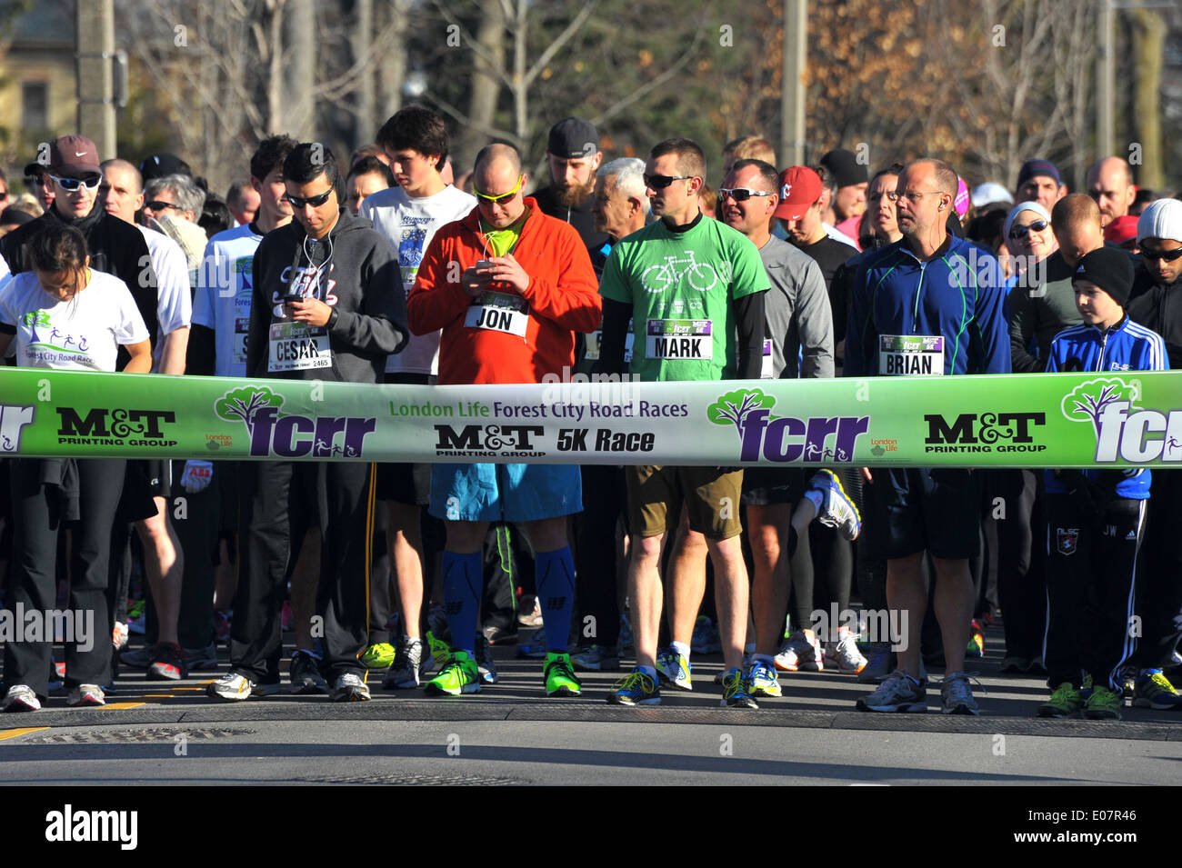 Runners at the start of a charity road race Stock Photo - Alamy