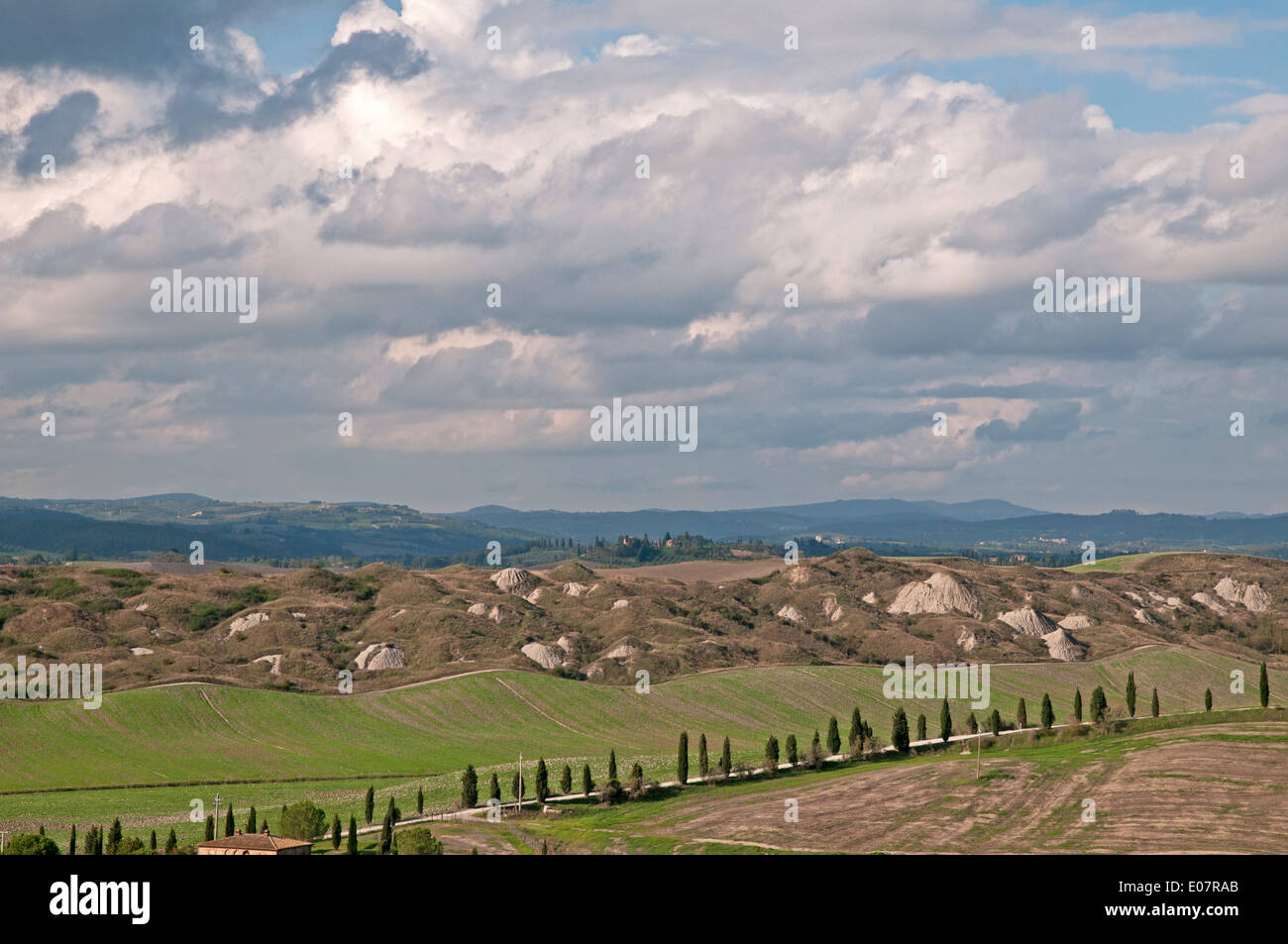 Clay formations or CRETE with cypress tree lined road leading to ...
