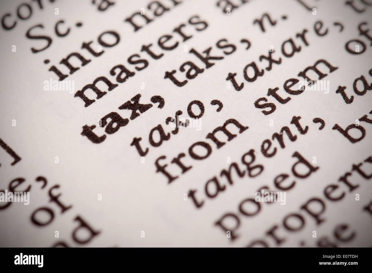 The word "Tax" in a dictionary Stock Photo - Alamy