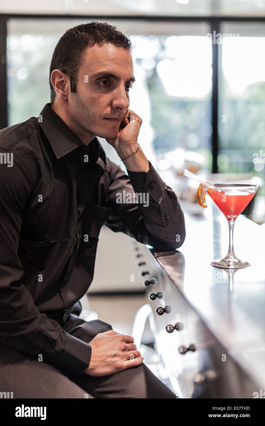 Attractive sad man sitting bar hi-res stock photography and images - Alamy