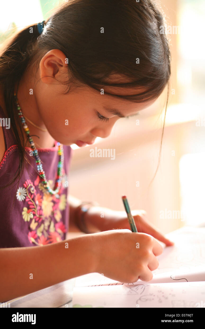 child reading a book ans studying (chinese child Stock Photo - Alamy