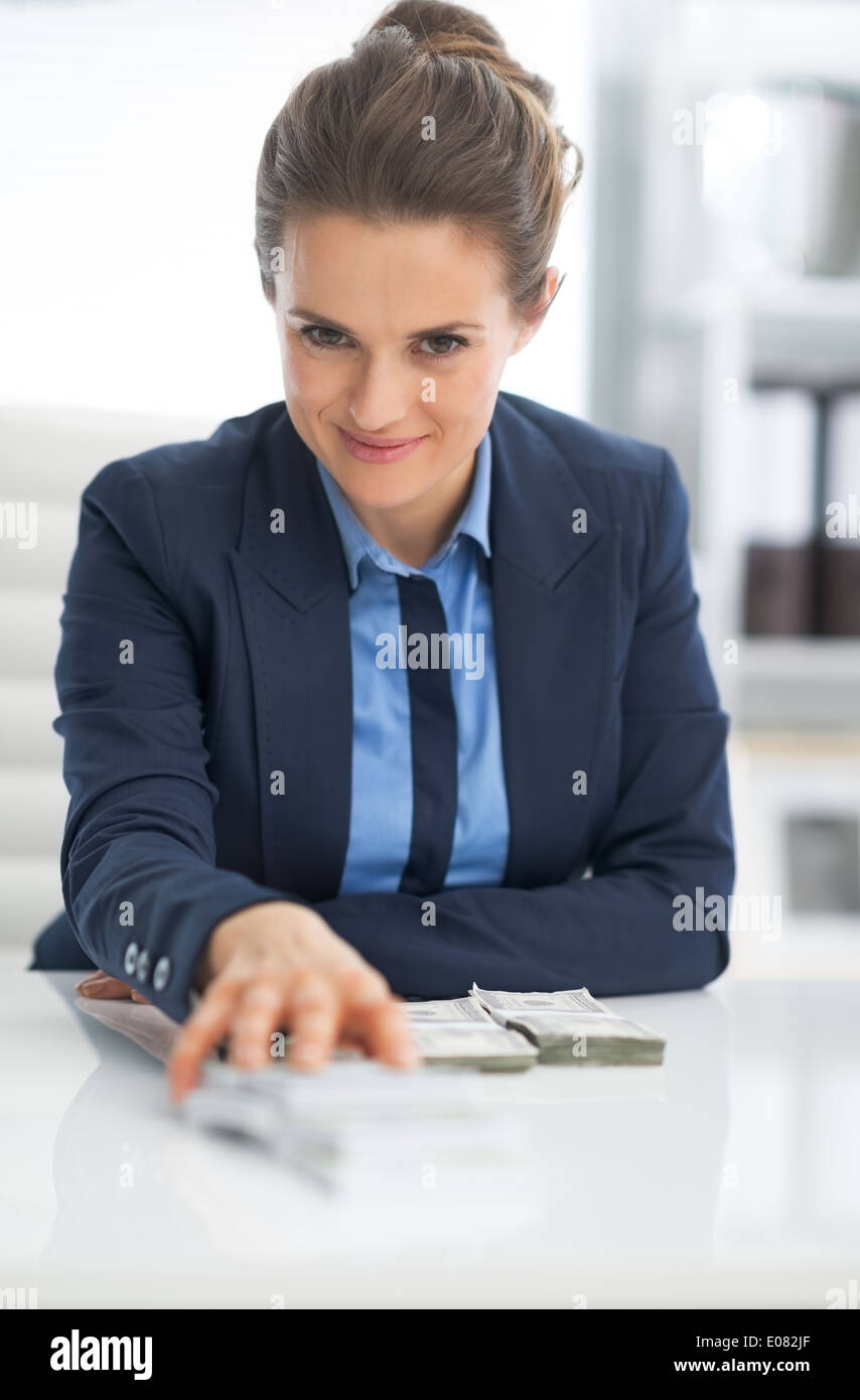 Woman giving money hi-res stock photography and images - Alamy