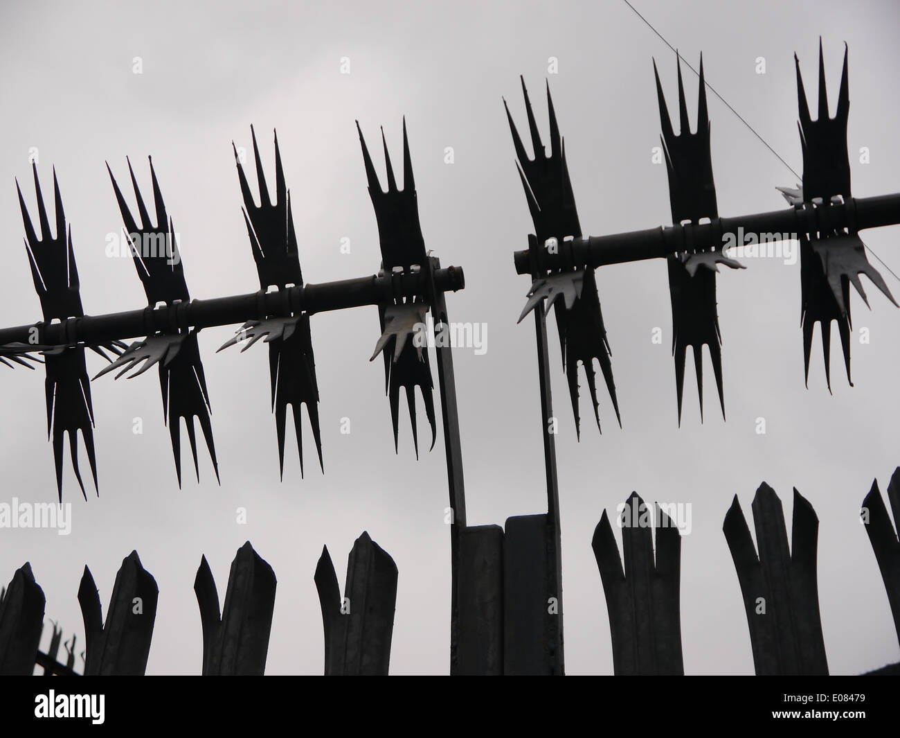 Abstract image of security apparatus on fence of commercial premises ...