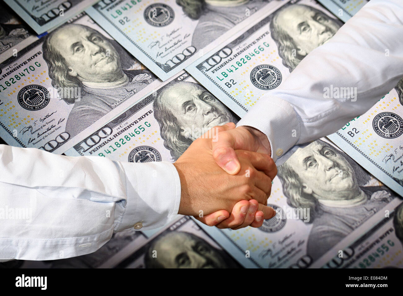 Handshake and Dollars Banknotes Background Stock Photo - Alamy