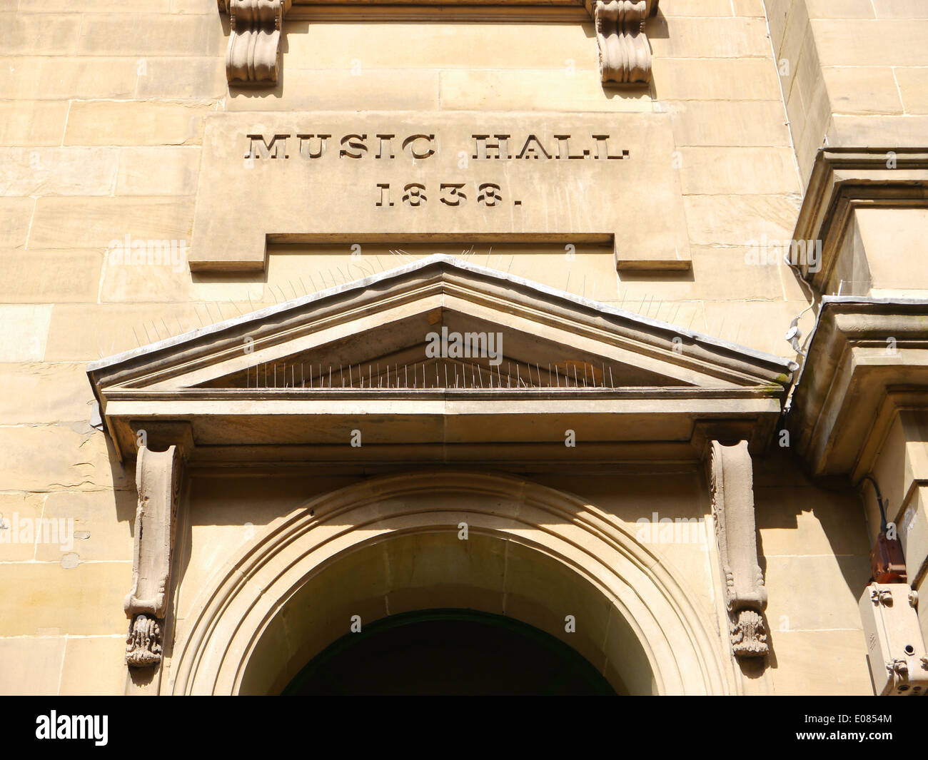 Architectural detail of an historic music hall building in which ...